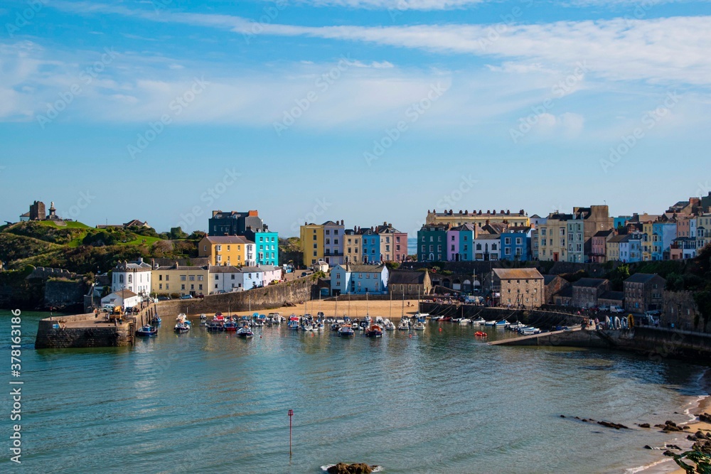 Tenby North beach sandy beach with the pinnacle of Goskar rock sticking ...