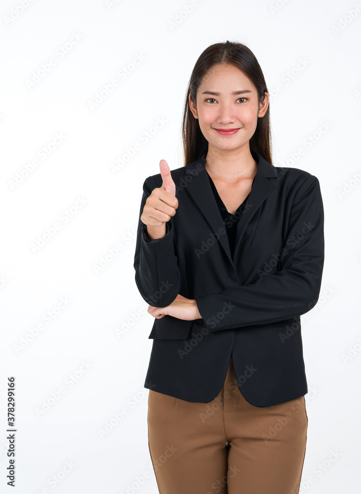 Young asian women in black suit with a smile lifted a finger thumb up. Stock Photo | Adobe Stock