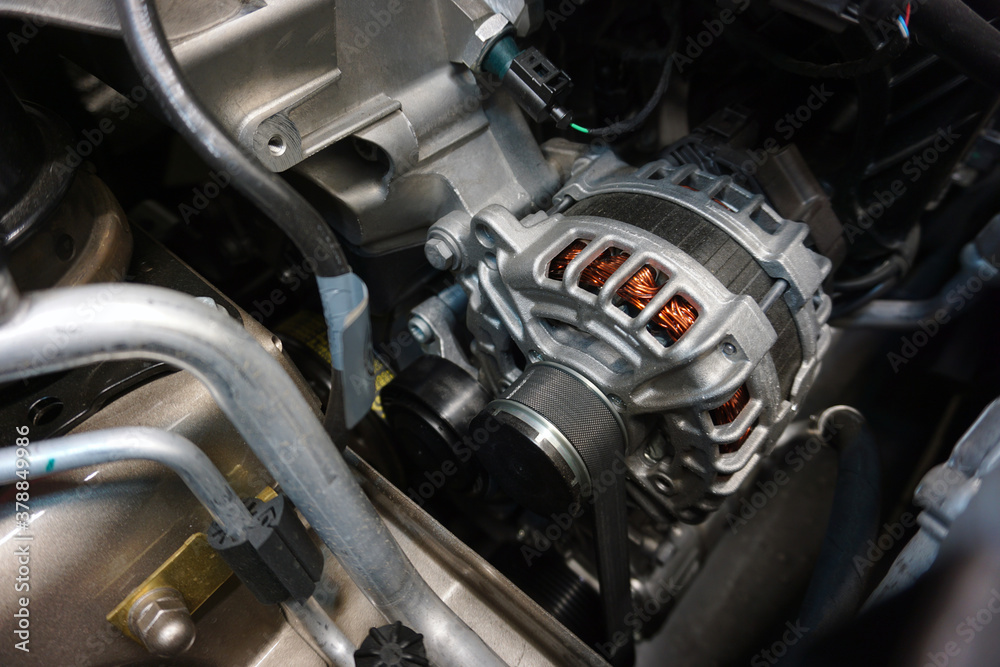 Generator (alternator) installed in the engine of a modern car. Stock ...