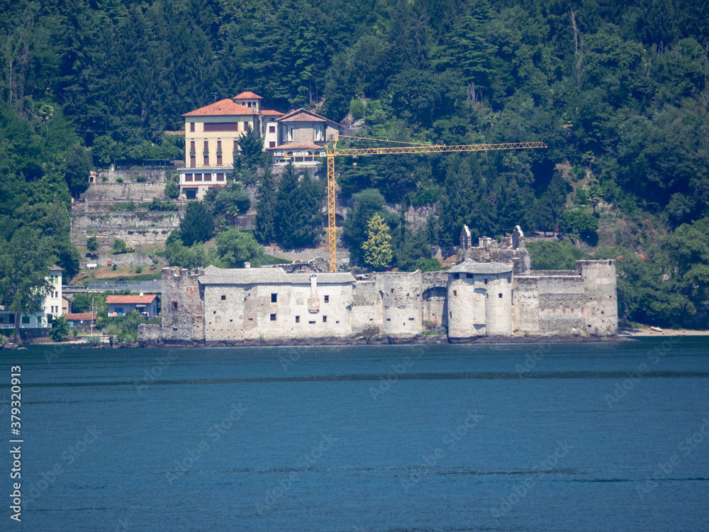 islet in the center of Lake Maggiore with an ancient abandoned and ...