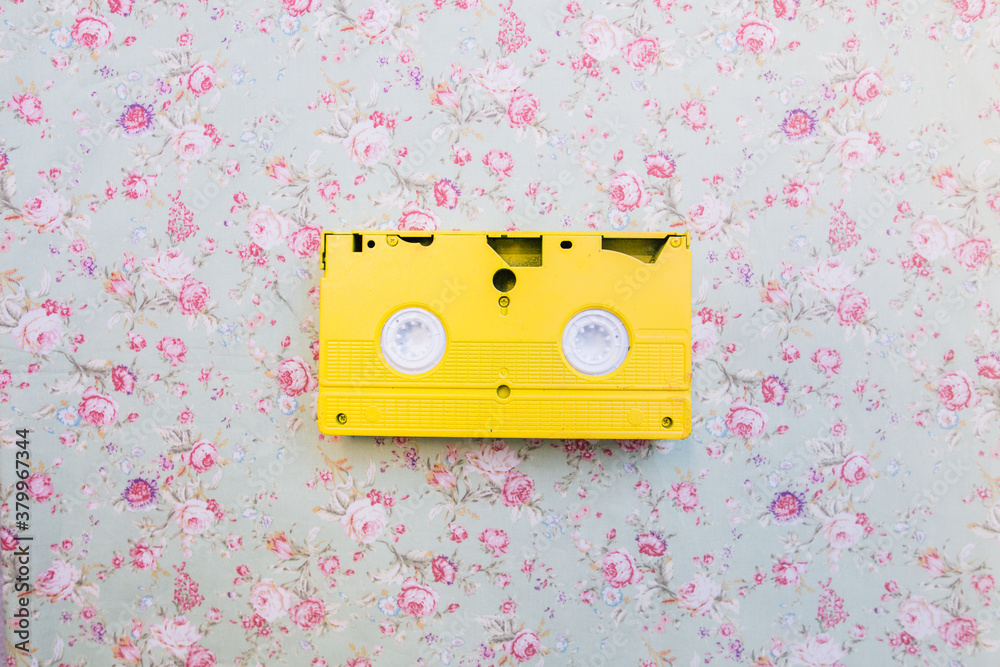yellow vhs record on a floral background Stock Photo | Adobe Stock
