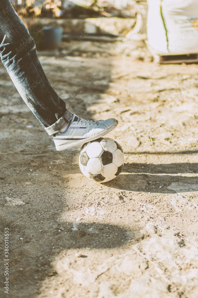Foot stopping a soccer ball. Stock Photo | Adobe Stock