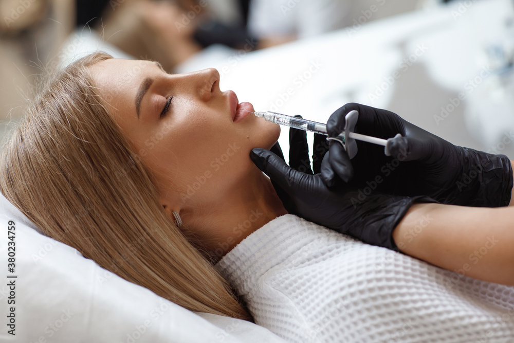 Enlarging lips, lip correction. Portrait white woman during an ...
