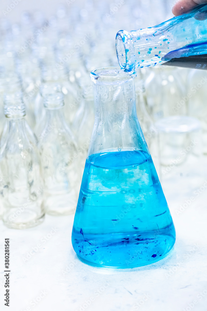 blue solution (methylene blue) in erlenmeyer, experiments in chemistry ...