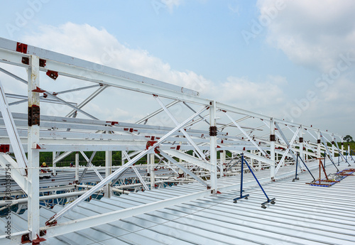 Steel structure roof monitor frame installation above roofing on new ...