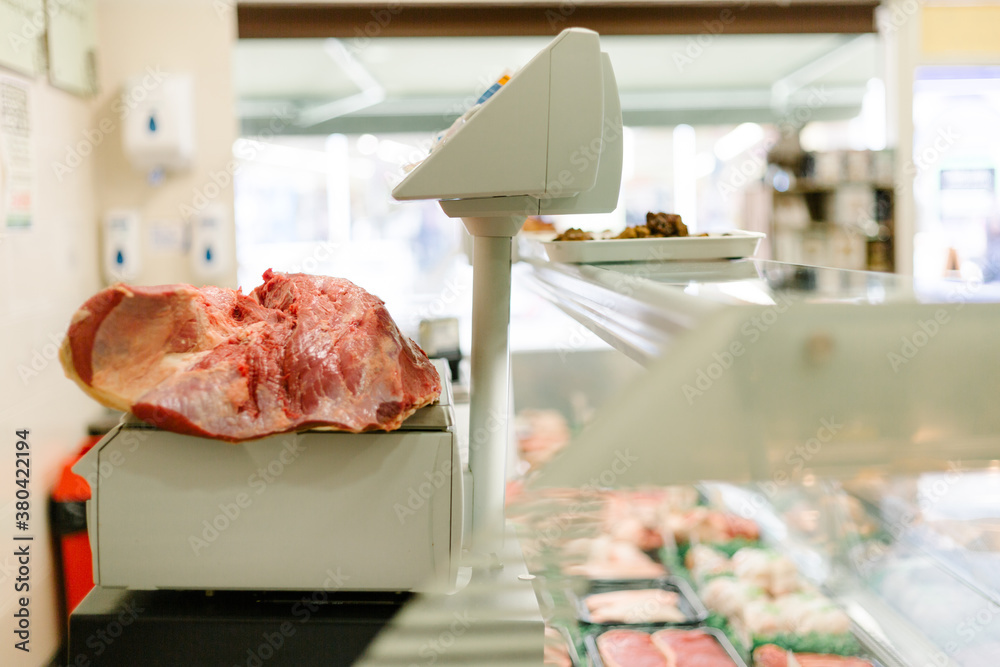 Large beef joint on scale in butcher shop Stock Photo | Adobe Stock