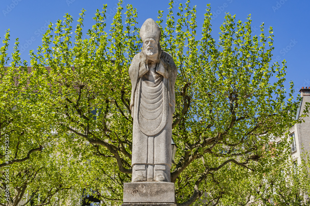Statue of Saint Denis (first bishop of Paris) holding his own head ...
