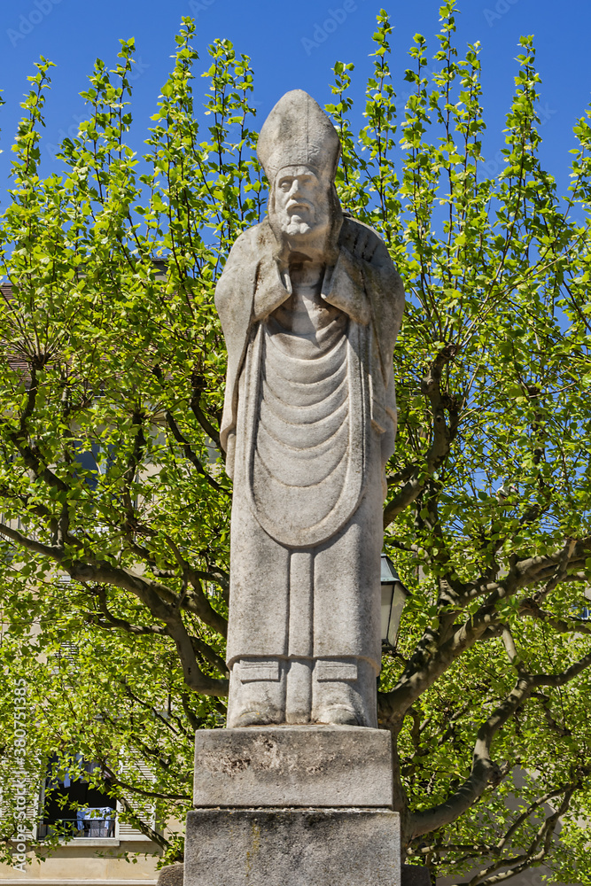 Statue of Saint Denis (first bishop of Paris) holding his own head ...