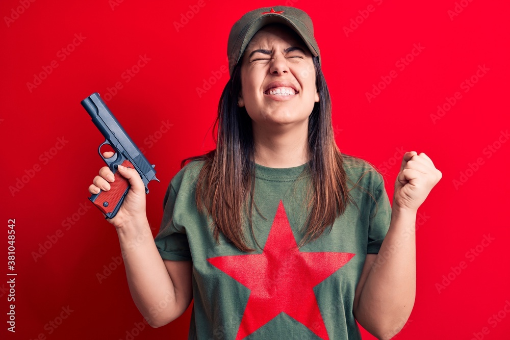 Young beautiful brunette woman wearing t-shirt with red star communist ...