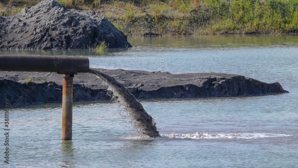 drainage of waste into a reservoir, dirty water Stock Photo | Adobe Stock