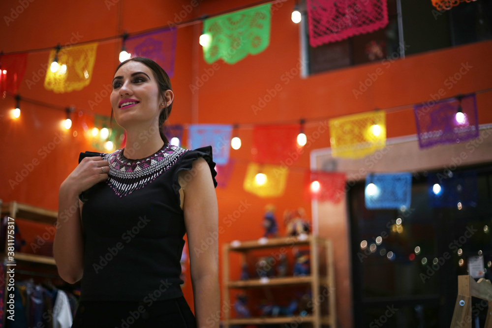beautiful smiling mexican woman in traditional mexican dress hands up ...