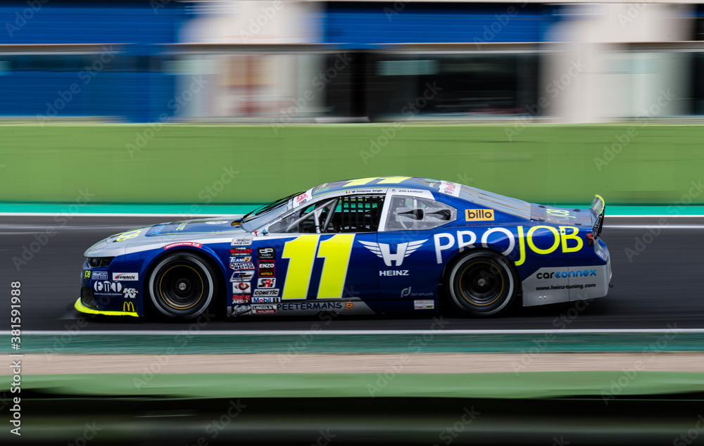 Motorsport Chevrolet Camaro Nascar series racing on asphalt circuit ...