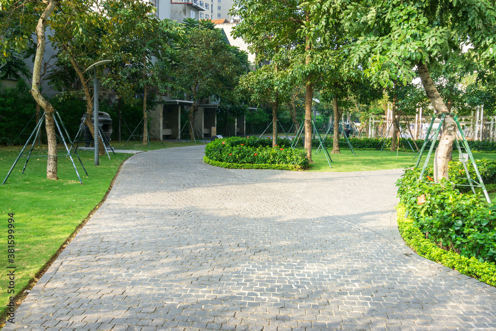Urban walking road among green trees inside modern apartment building ...