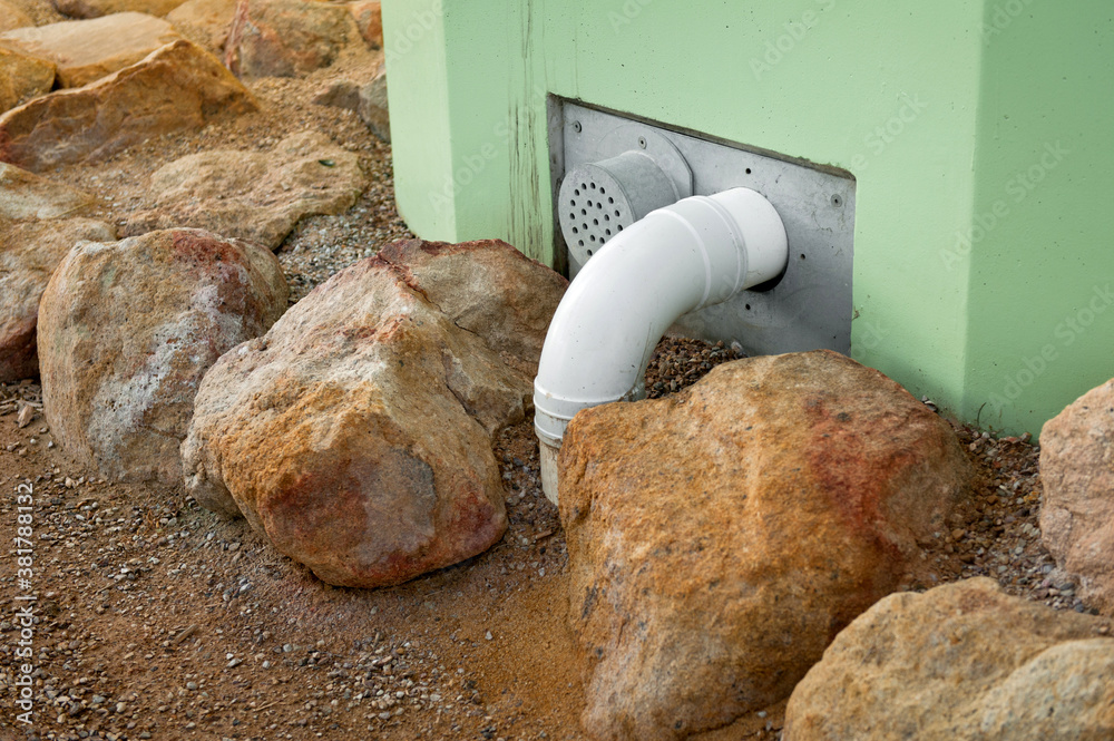 Drainage pipe for draining rainwater. Puddles wirh rainwater ...