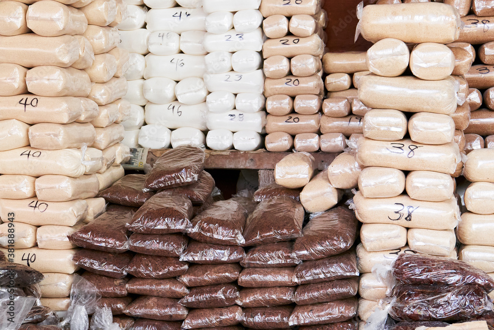 Close-up view of a market stall selling a variety of different sugar ...
