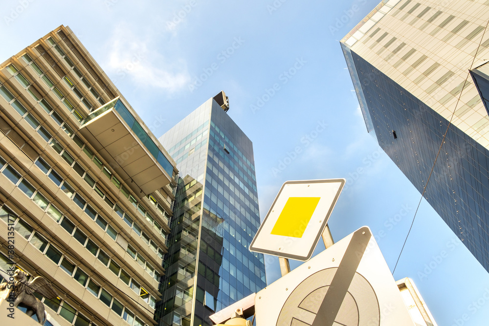 Perspective view of modern high-rise glass skyscraper building and main ...