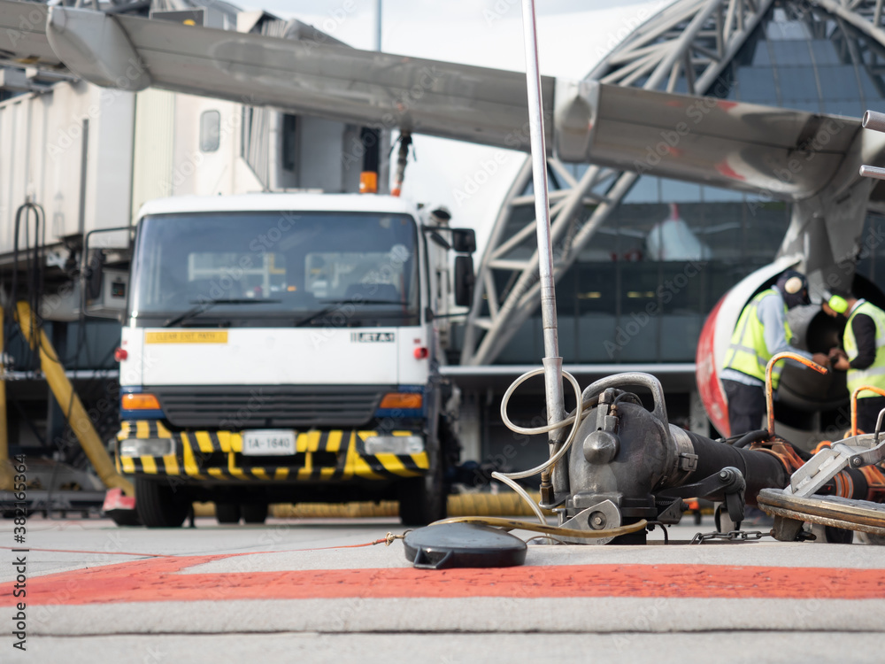 Jet A1 gasoline refueling to aircraft during transit. nozzle connect ...