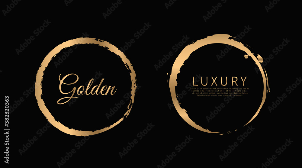 Gold paint brush strokes isolated on black background. Golden circle ...