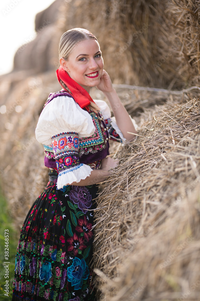 Young beautiful slovak woman in traditional costume. Slovak folklore ...