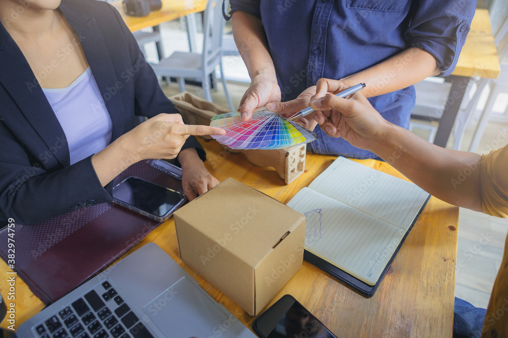 Team designer working graphic packaging design with color chart and ...