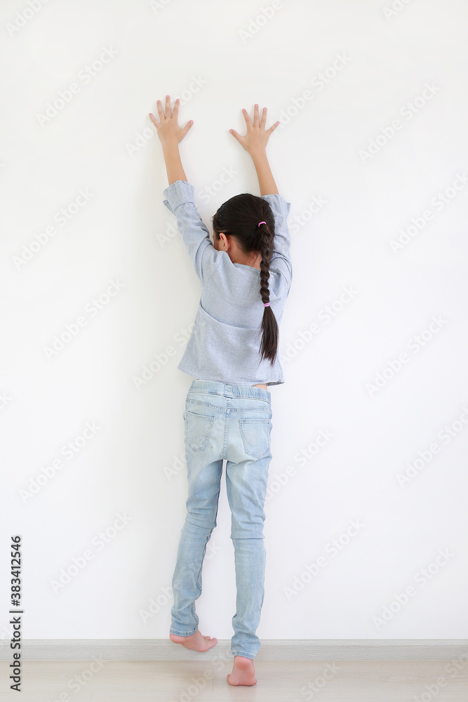 Asian little child girl raise hand up and climbing posture at white ...