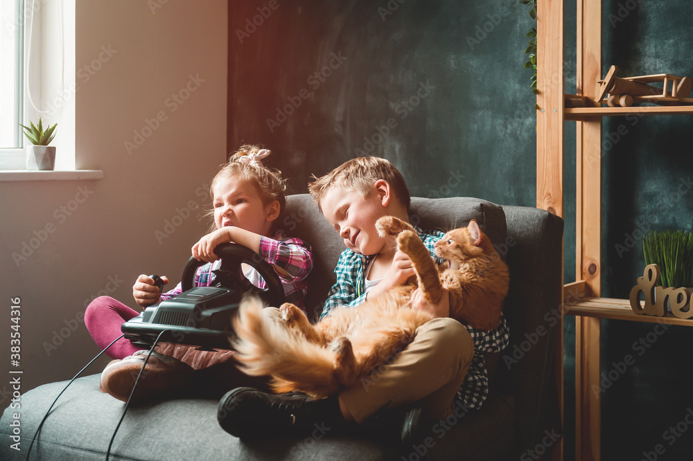 Two kids boy and girl playing video games using tablet pc with console ...