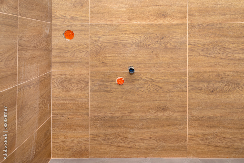 Water pipe and a sewer pipe coming out of a wall in a modern boiler ...