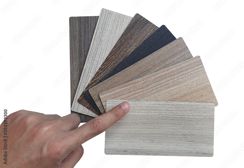 male hand pointing to wooden laminated samples serie collection ...