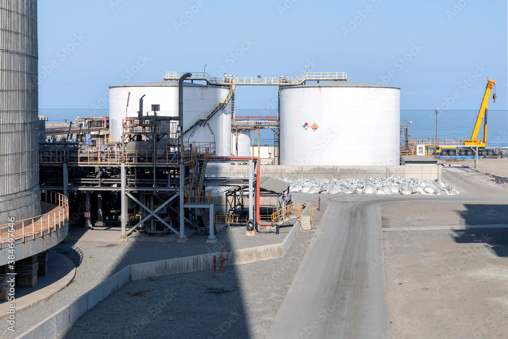View of the sulfuric acid storage tanks in the chemical plant. Sulfuric ...