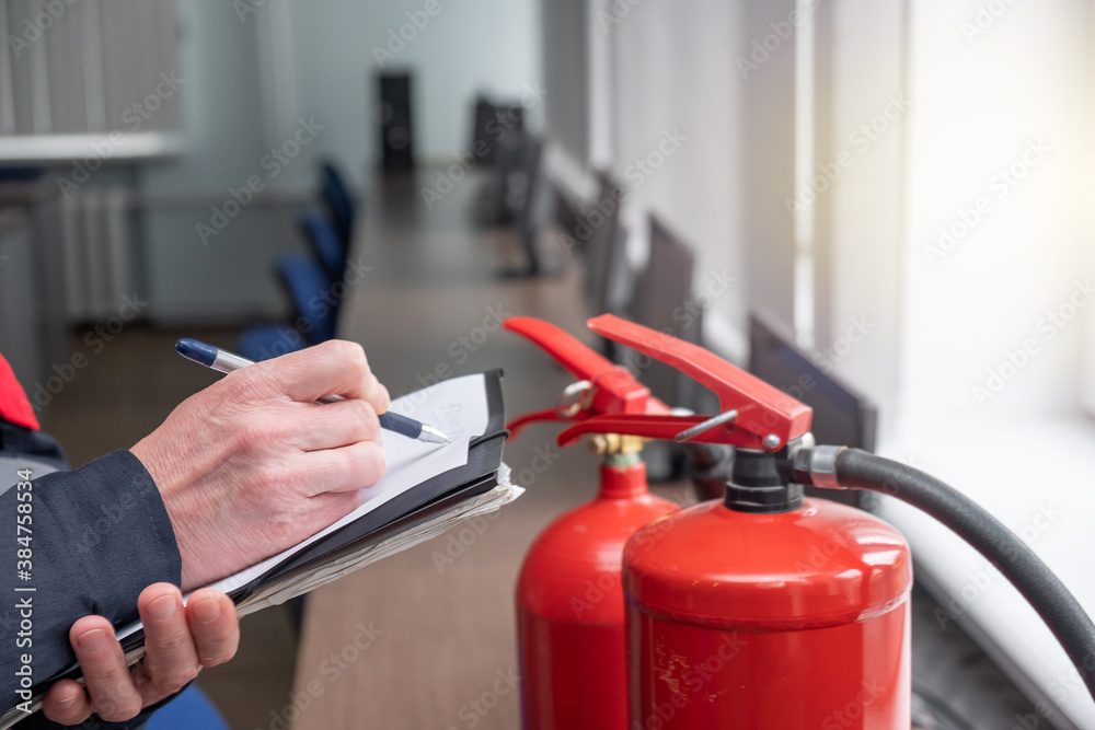 Photo Stock Engineer Professional are Checking A Fire Extinguisher ...