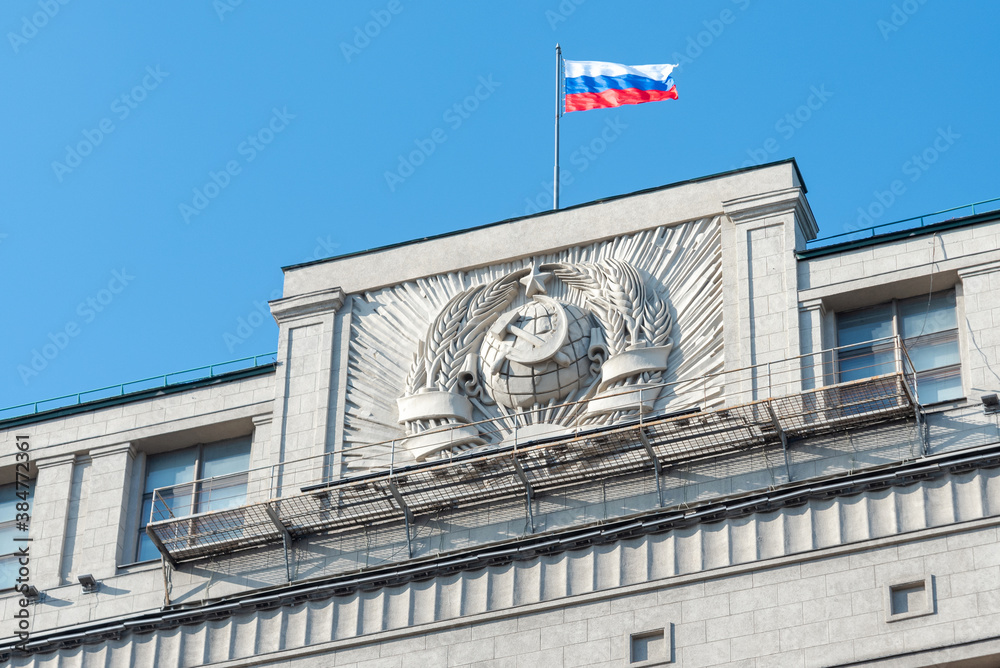 Soviet coat of arms on the wall on top of the State Duma building in ...