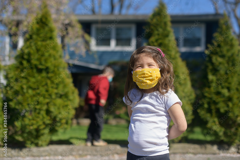 Little girl wearing face mask Stock Photo | Adobe Stock