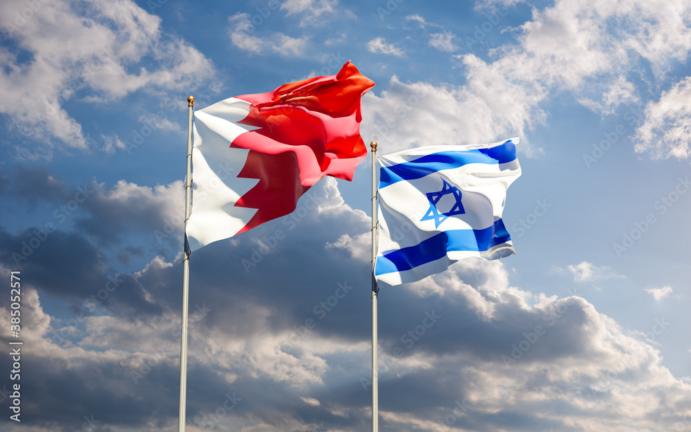 Flags of Israel and Bahrain together against the sky background ...