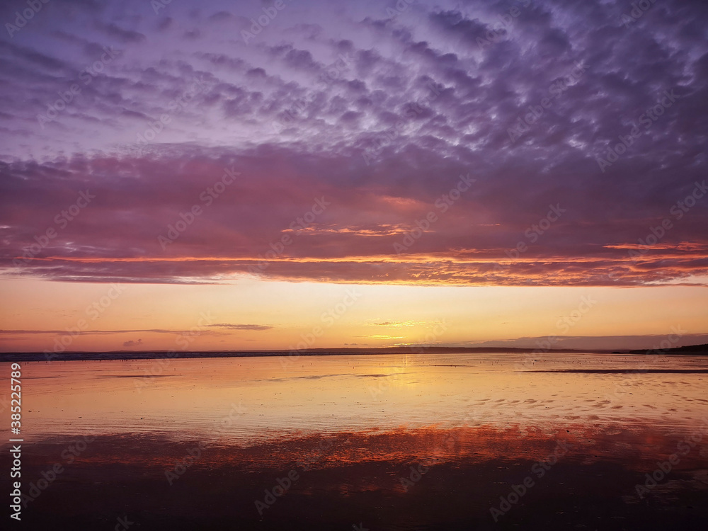 Dramatic sunset on Cefn Sidan beach with Cirrostratus clouds - is a ...