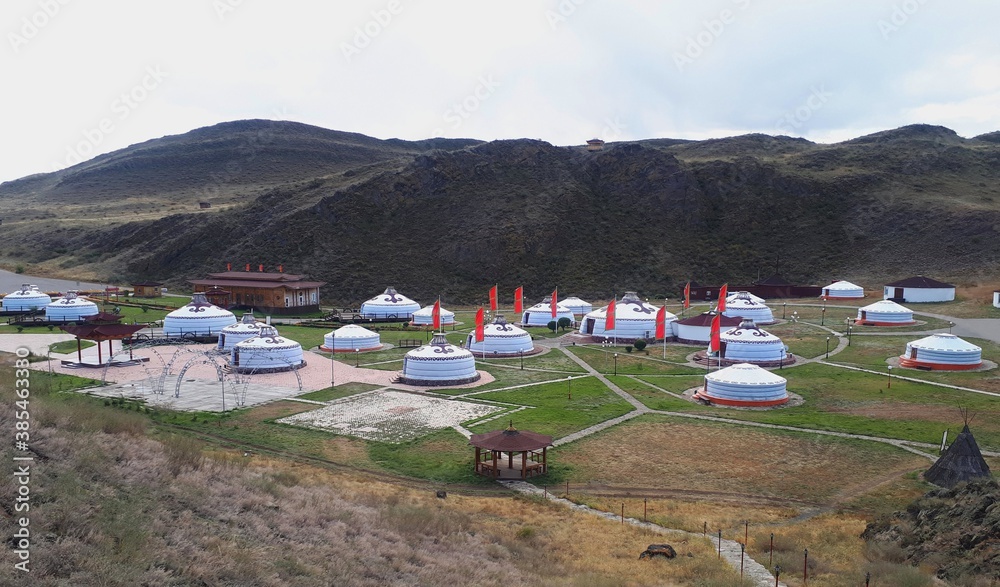 View of a nomadic camp Aldyn-Bulak and white yurts. Indigenous life and ...
