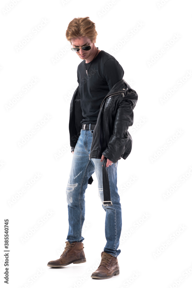 Cool young handsome redhead man fashion model removing black leather ...