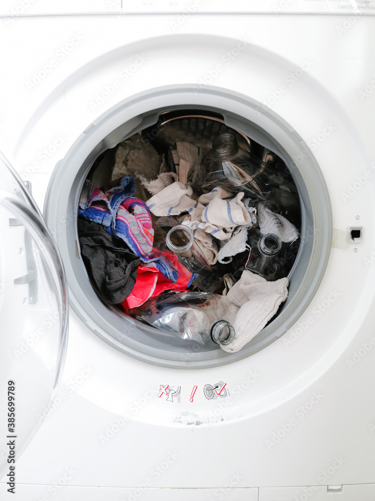 Washing machine filled with plastic waste representing micro plastic ...