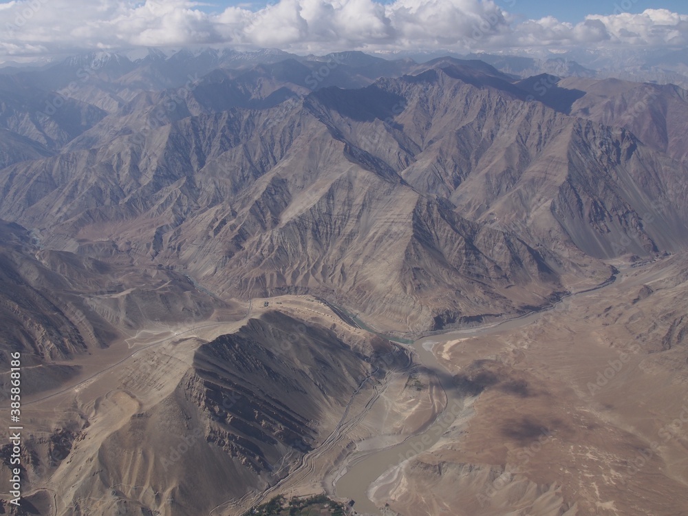 View of Ladakh's wilderness and beautiful skies from above the plane ...