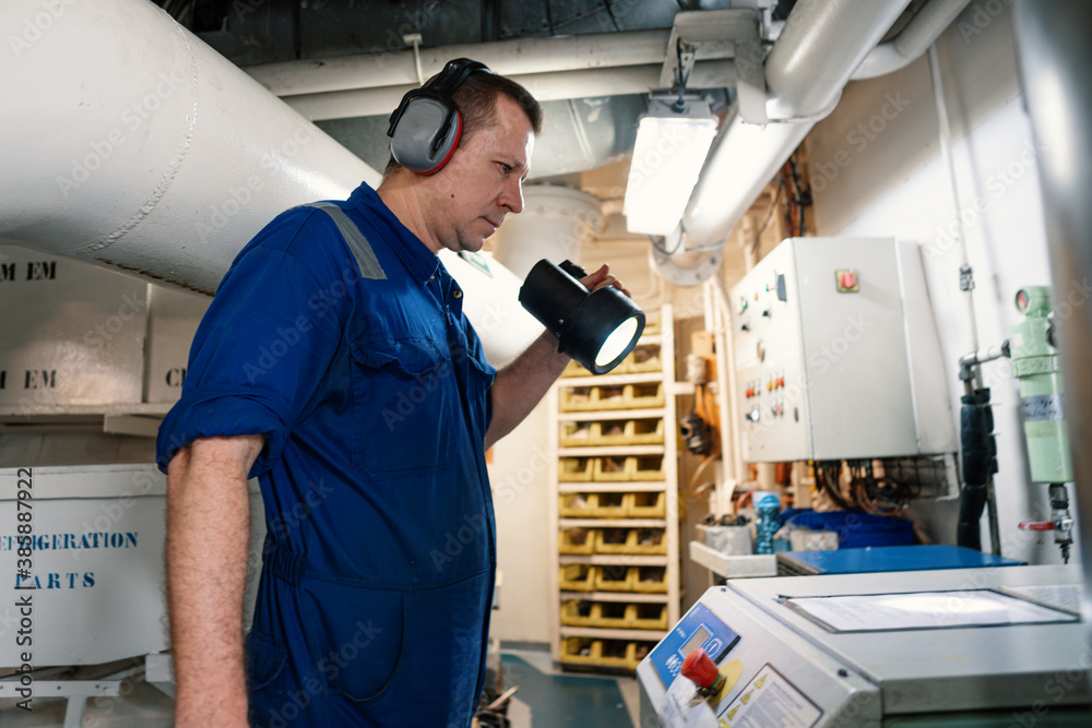 Marine engineer officer controlling vessel enginesand propulsion in ...