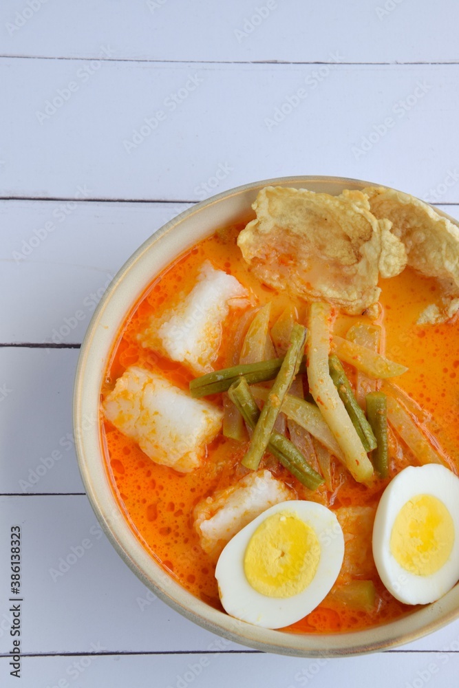Lontong Sayur, Indonesian cuisine. Compressed rice cake or lontong with ...