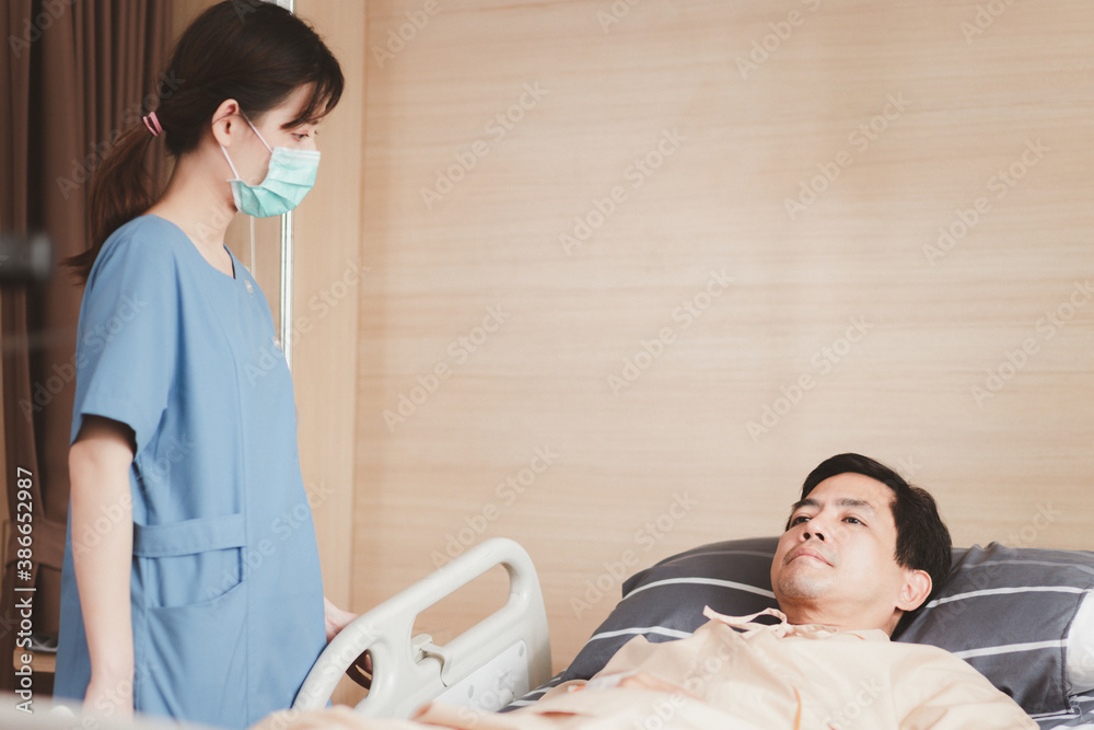 Asian female doctor and nurse wearing mask checking health of senior ...
