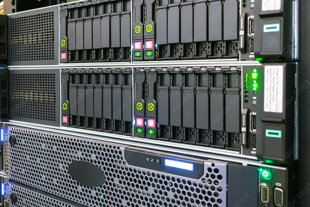 Computer hardware works in the server room. The front panel of hosting ...