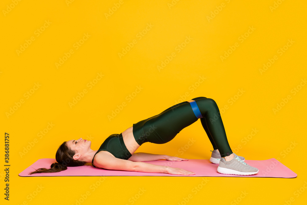 Sporty lady house gym training stretch resistance expander stripe wear ...