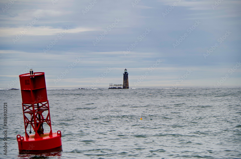 Ram Island Ledge Light Station lighthouse and red metal buoys are a ...