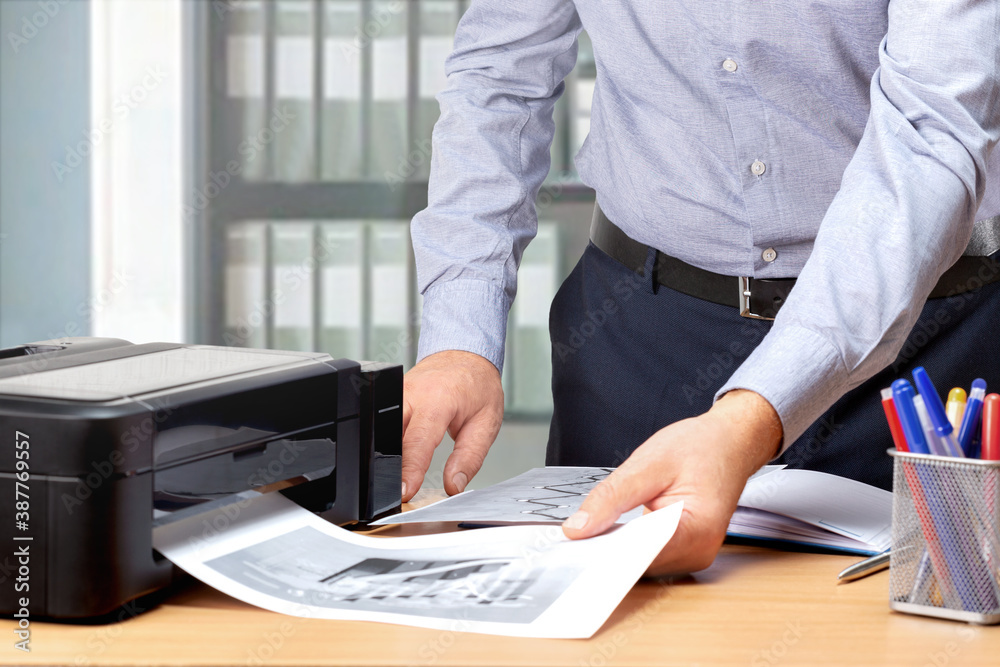 Man working on charts and data, graphs analysis n the office ...