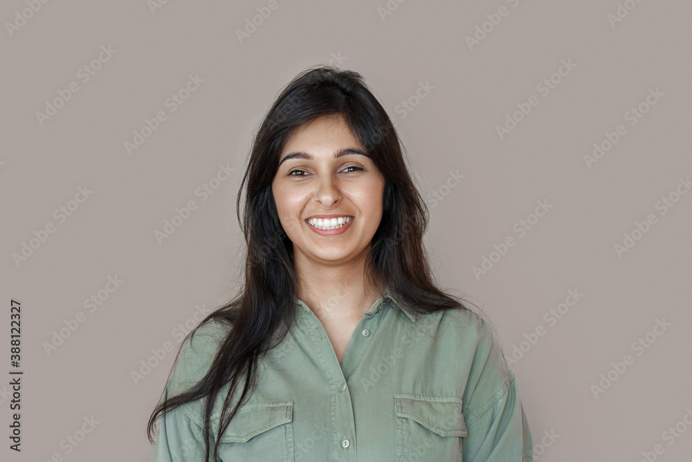 Smiling cheerful young adult indian woman looking at camera, happy ...
