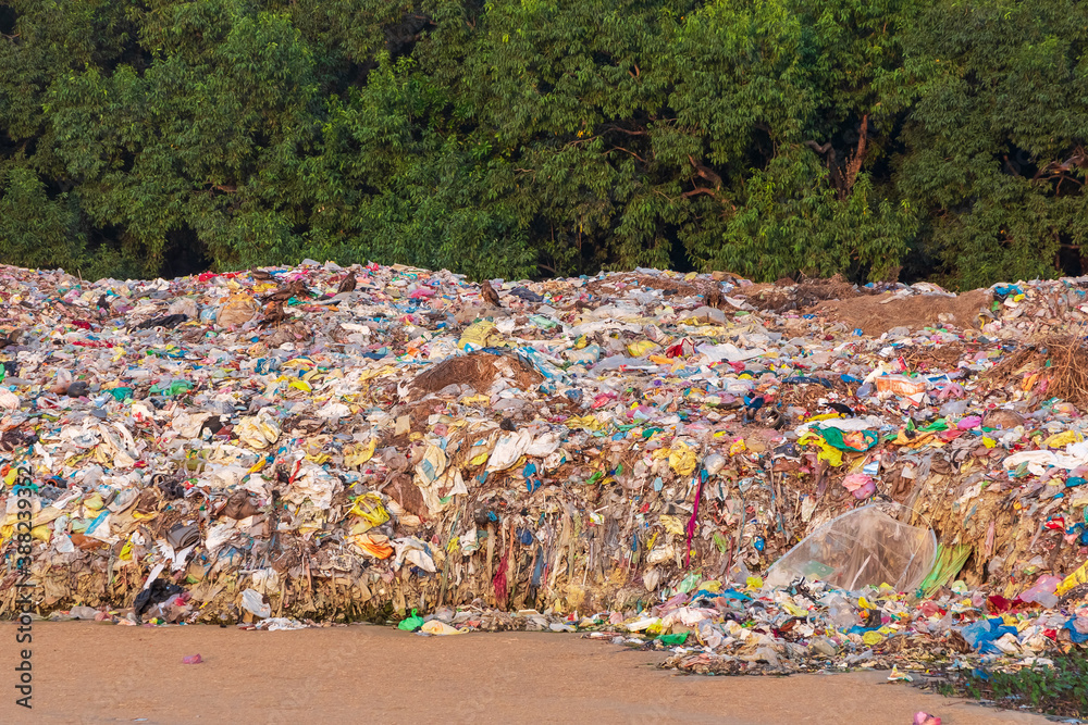 Waste Garbage Landfill. Heap of garbage at a junkyard near the river ...