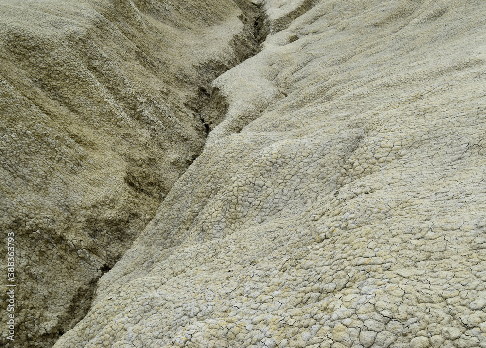Undulated water canal in dry soil texture. The Berca Mud Volcanoes is a ...
