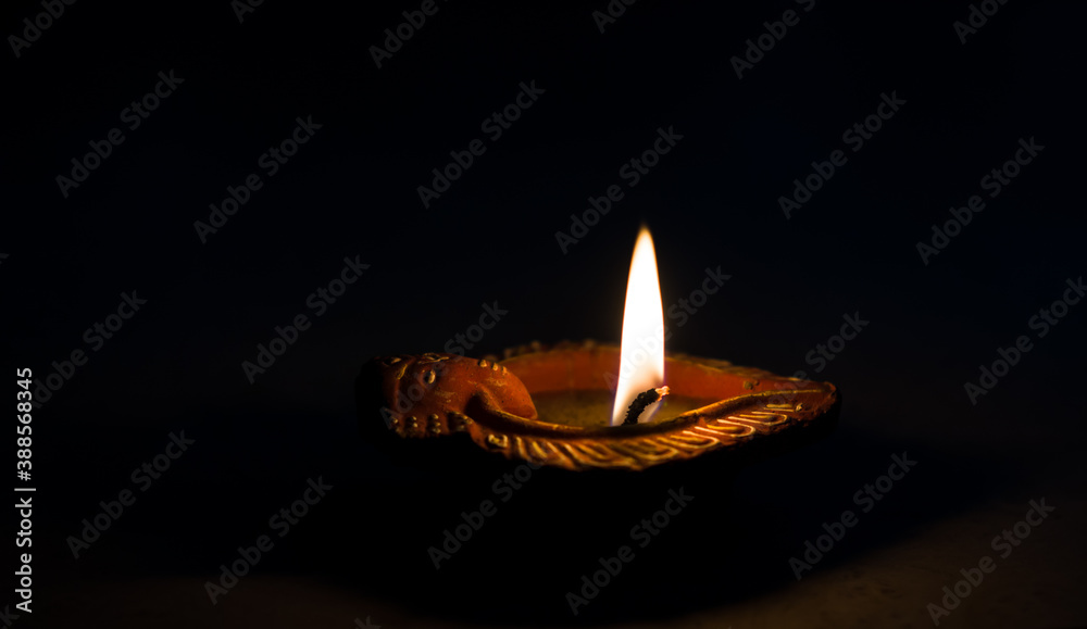 Diwali Diya oil lamp also known as diva. Diwali is biggest festival of India. Diwali is festival of lights and happiness. Stock Photo Adobe Stock