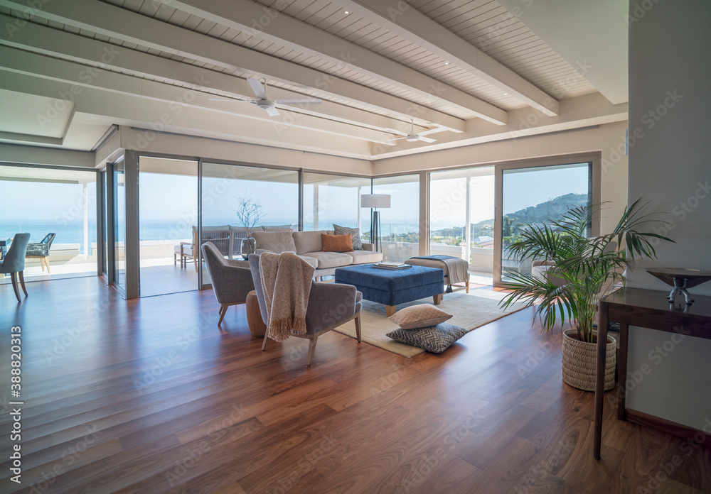 Home showcase interior with hardwood floors and wood beam ceiling Stock ...